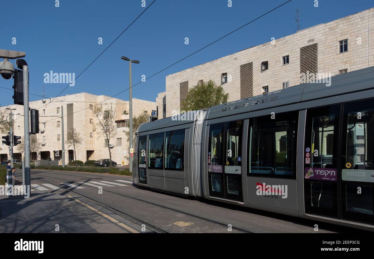 The Jerusalem Light Rail or Jerusalem Tramway passing through Pisgat Ze ...