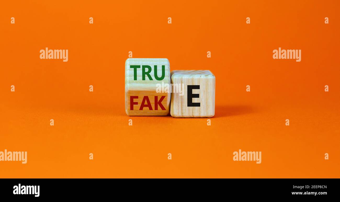 Fake or true symbol. Turned a wooden cube and changed the word 'fake ...