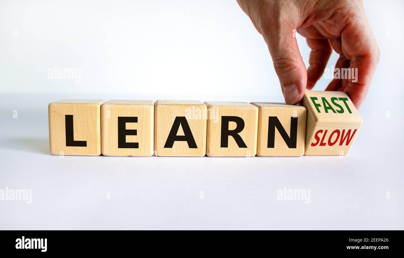 Learn slow or fast symbol. Businessman turns wooden cubes and changes ...
