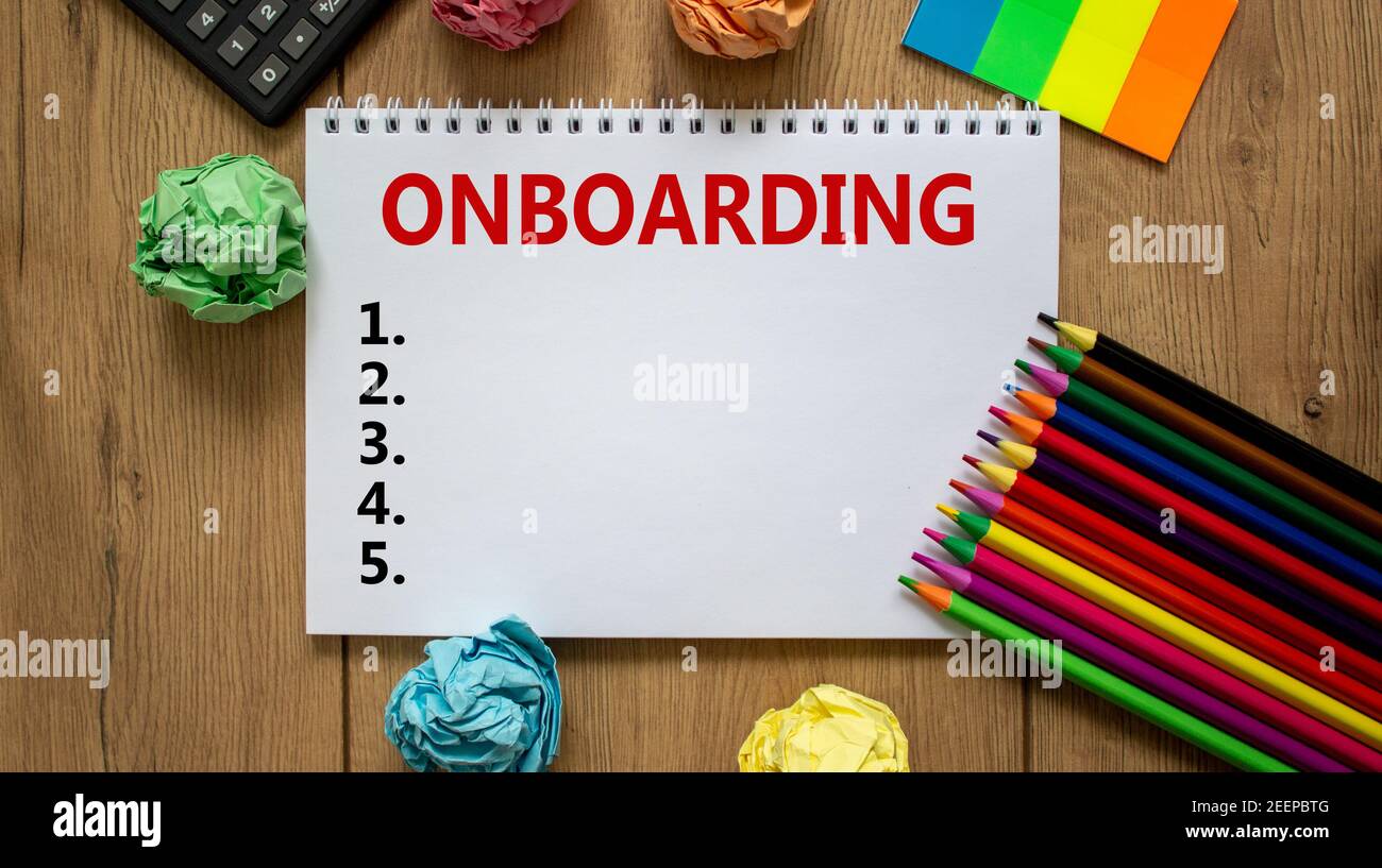 Onboarding symbol. White note with a word 'onboarding' on beautiful ...