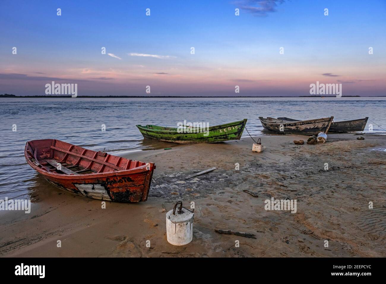 Wooden fishing boats on the shore / riverbank of the Paraná River / Río ...