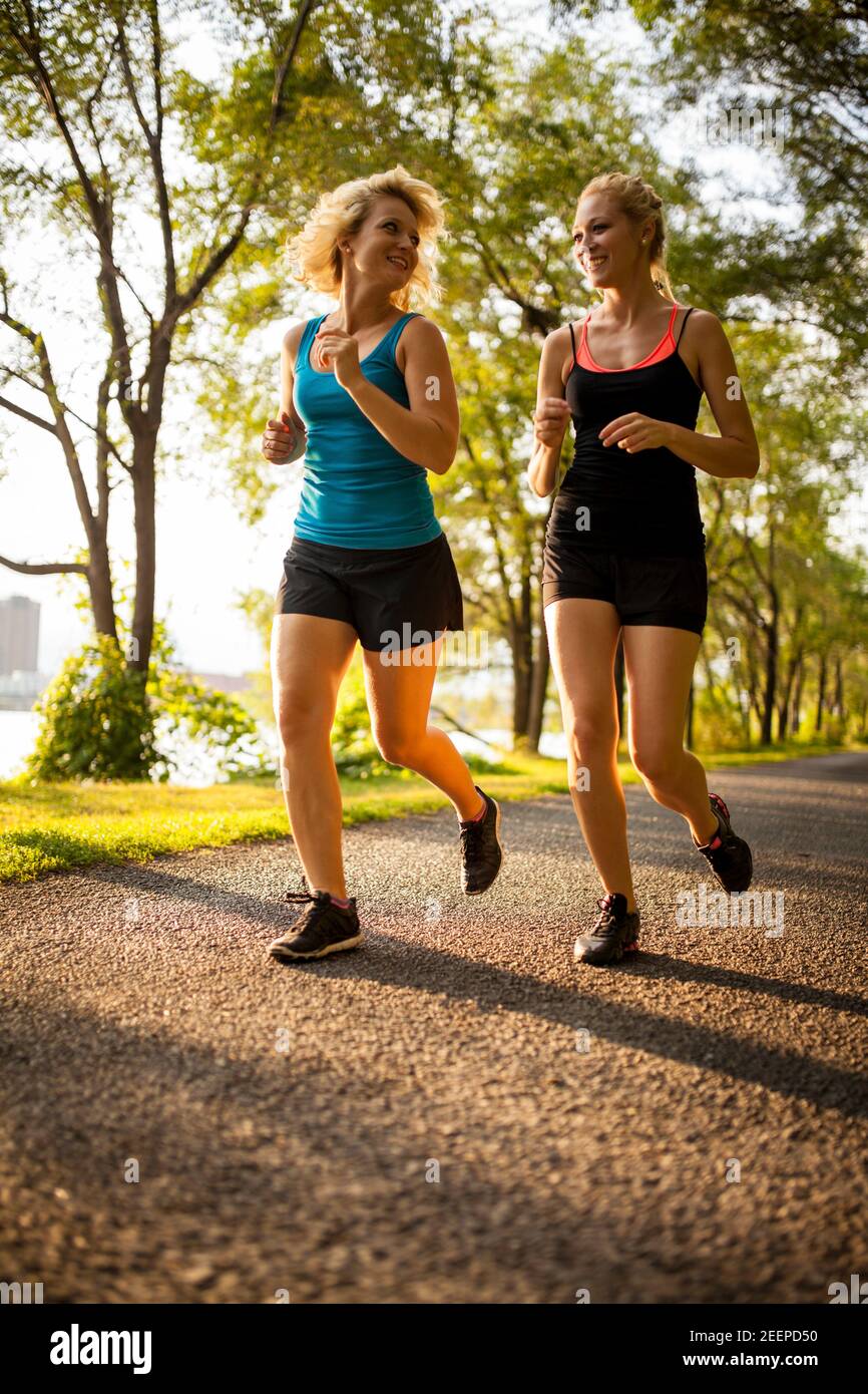 Young blonde women running in the park hi-res stock photography and ...
