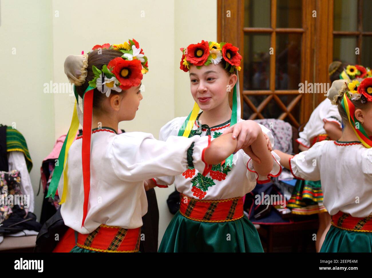 Group of little girls dancers in a native Ukrainian costumes preparing ...