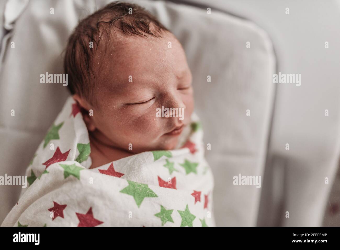Side angle of newborn baby boy swaddled in birthing center Stock Photo ...