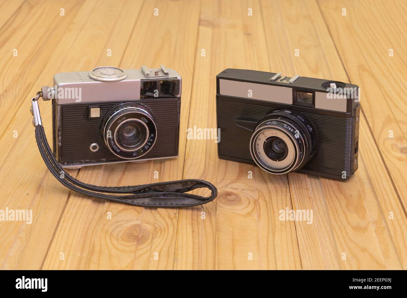 Two old retro cameras on wooden background. Concept of photography ...