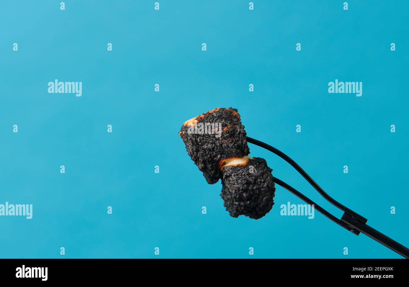 Two burnt marshmallows previously fire while roasting Stock Photo - Alamy