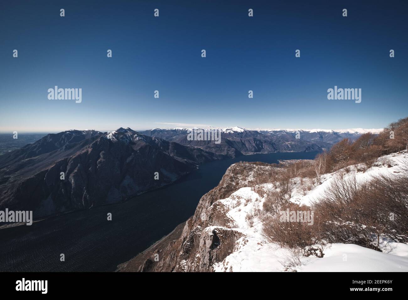 Beautiful view of rocky cliffs covered with snow under the bright sky ...