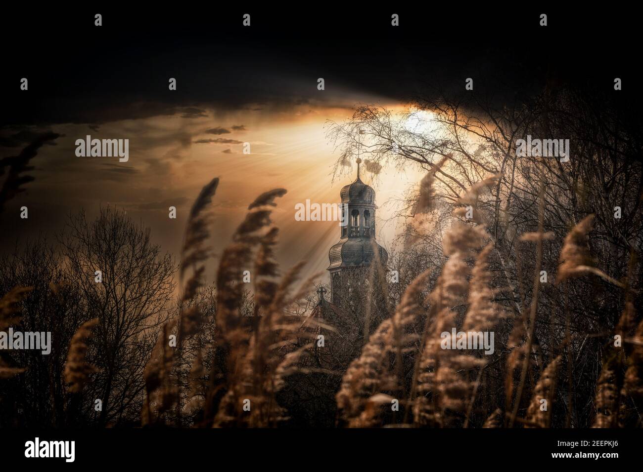 Church cloth in a gloomy setting mood and a dark sky with sun rays ...