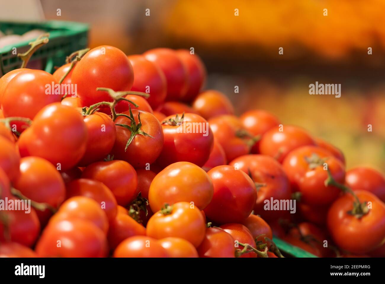 Organic tomatoes lying on display in organic super market Stock Photo ...