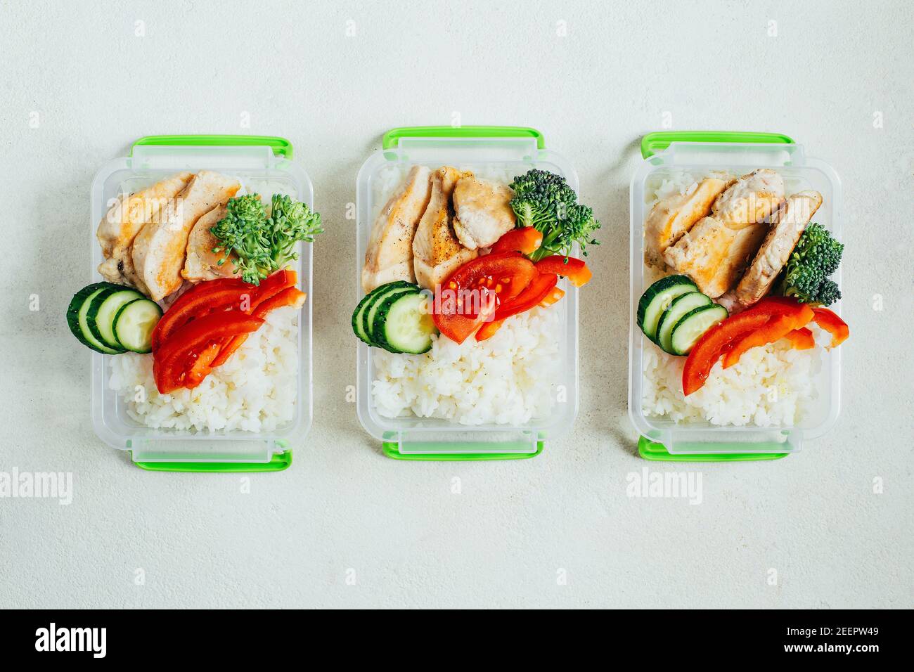 top view of lunch boxes with food on white background Stock Photo - Alamy