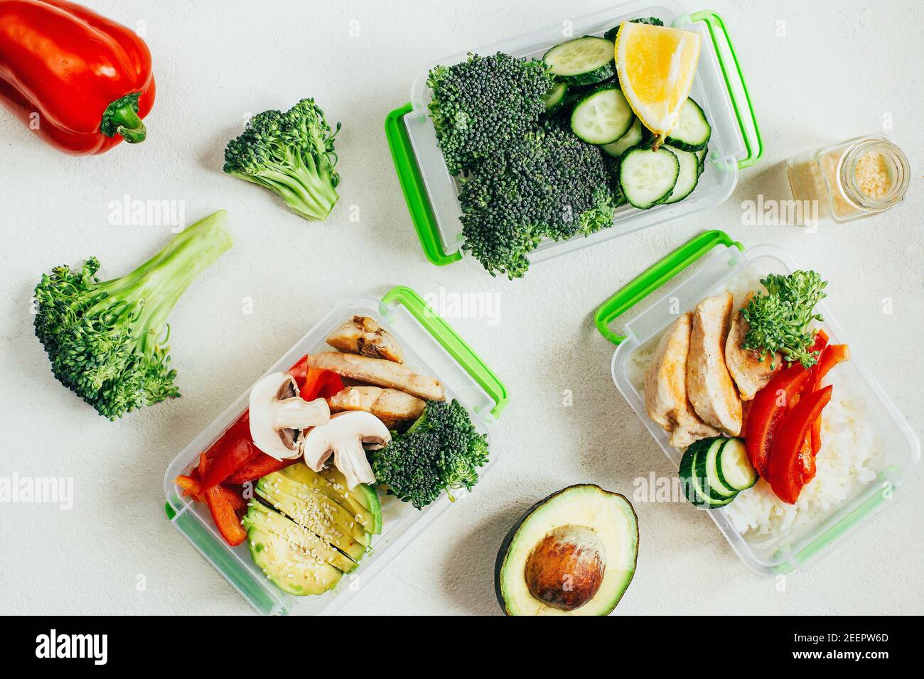 top view of lunch boxes with food on white background Stock Photo - Alamy