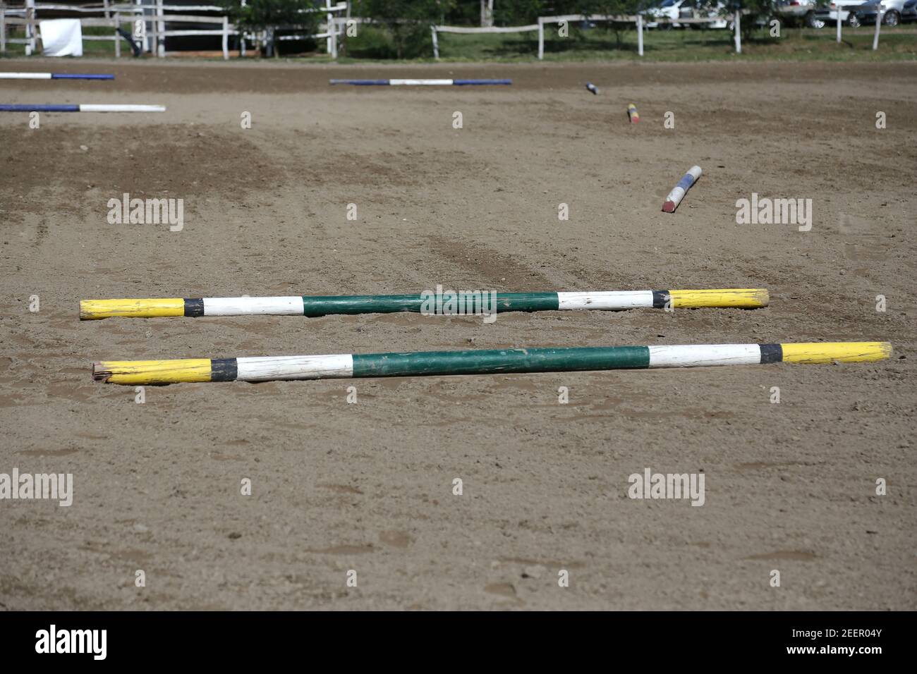 Colorful barriers on the ground for jumping horses and riders at riding ...