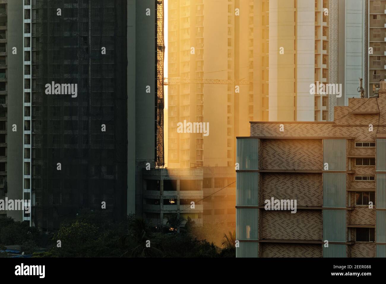 Tall skyscrapers in downtown suburban Mumbai with evening sun rays ...
