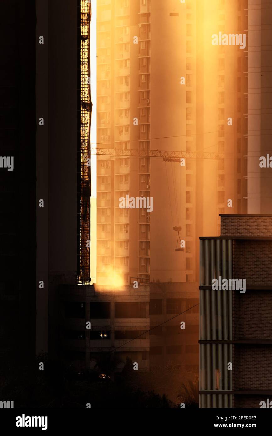 Tall skyscrapers in downtown suburban Mumbai with evening sun rays ...