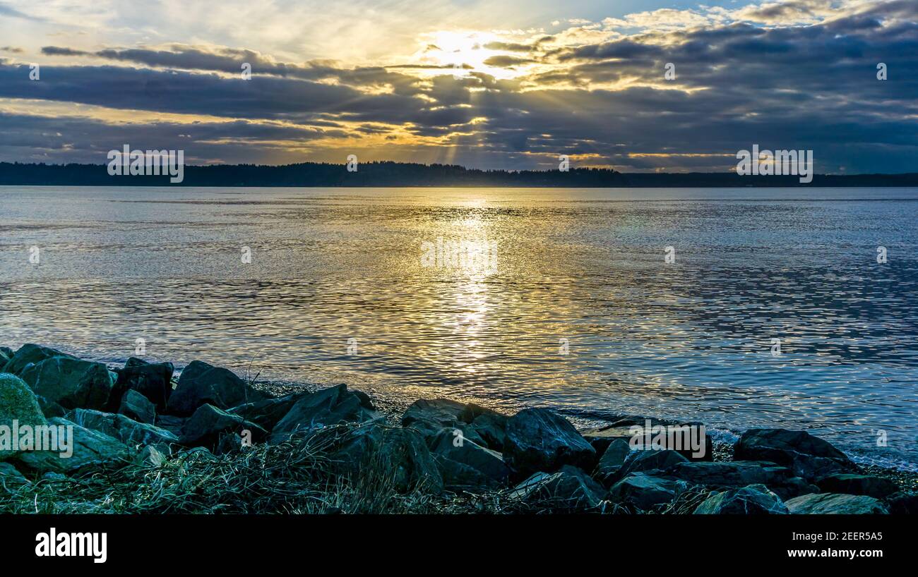 A view of clouds with ray of light shining through over the Puget Sound ...