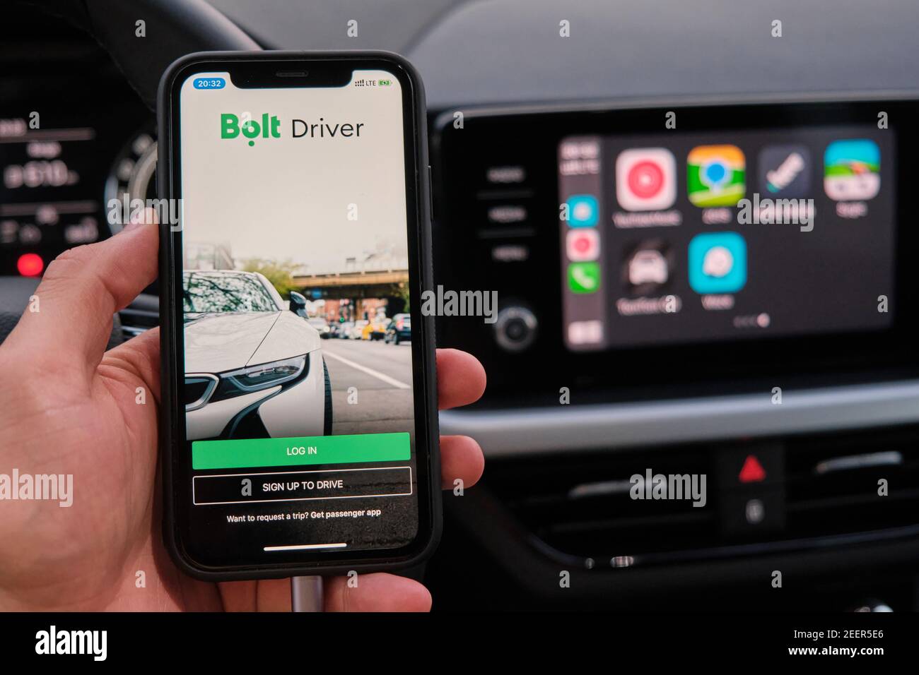 Bolt Driver on the screen of smart phone in mans hand on the background ...