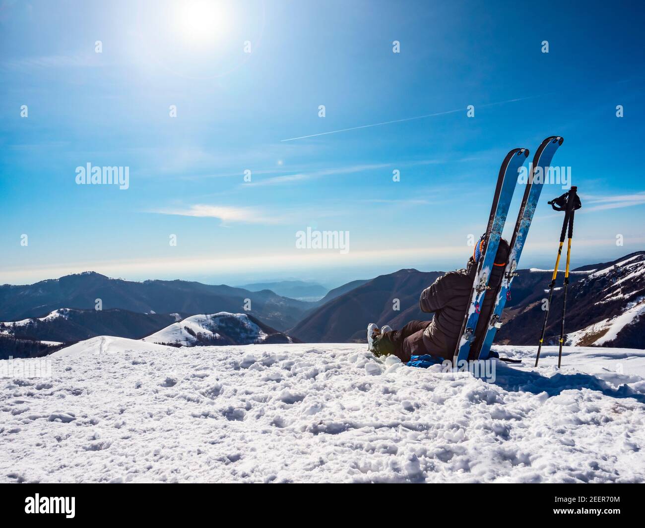 Ski mountaineer relaxing on the top of a mountain Stock Photo - Alamy