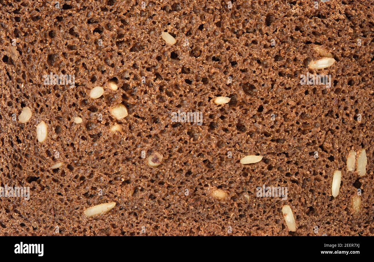 texture of a slice of bread made from rye flour with sunflower seeds ...