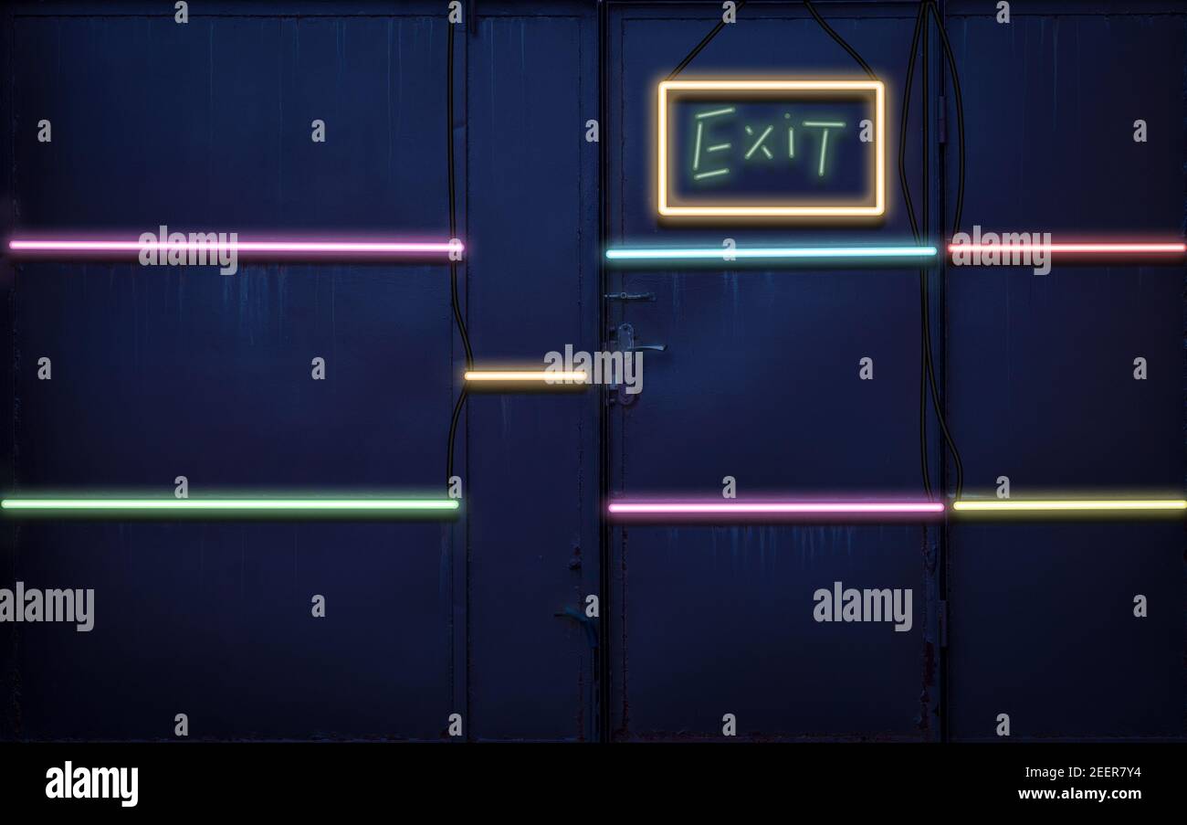 metal gate with a handle and a lock illuminated by neon tubes at night ...