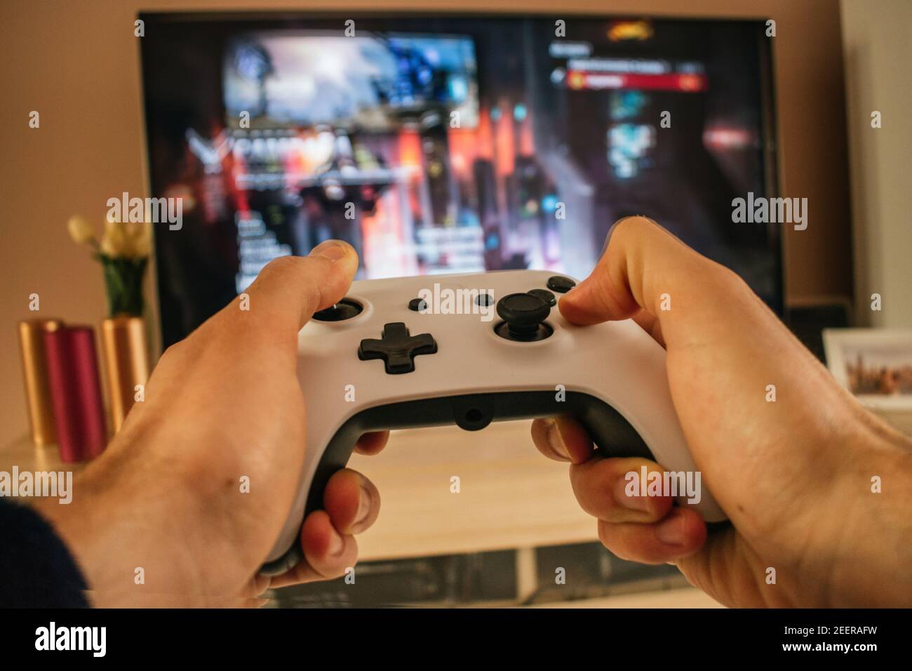man playing with gamepad console Stock Photo - Alamy