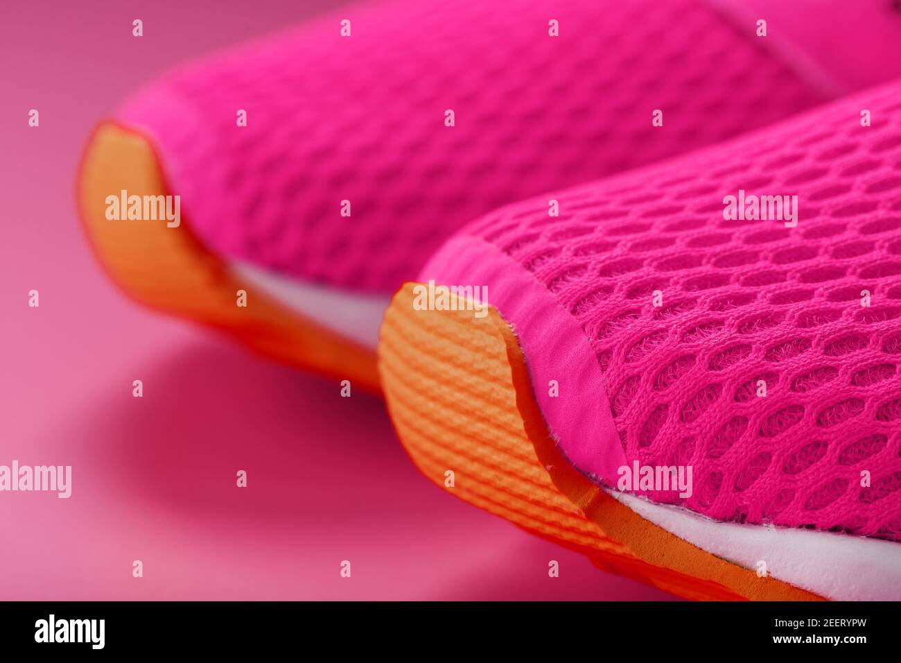 Sports pink sneakers on a pink background with free space. Top view ...