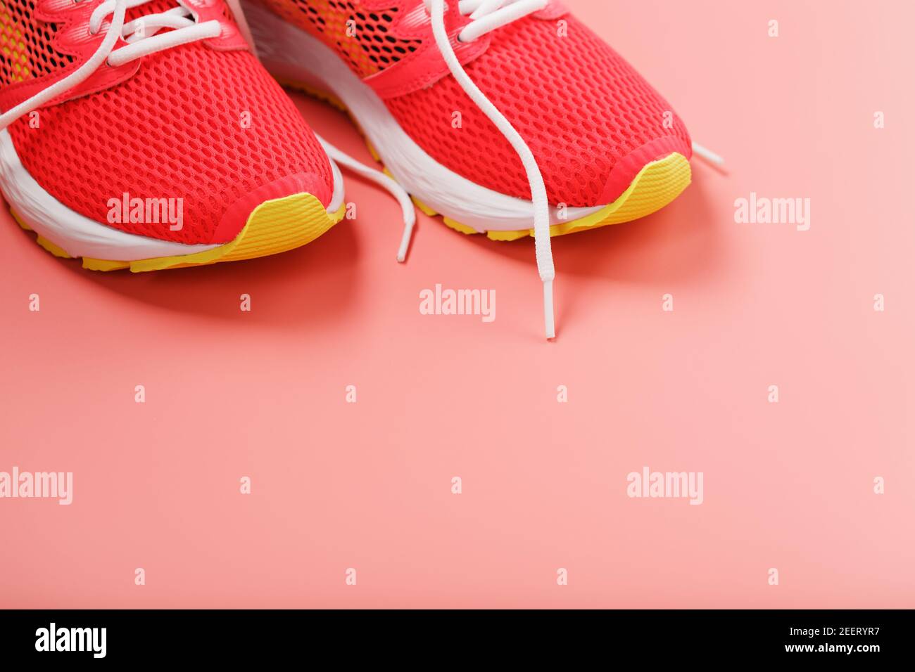 Sports pink sneakers on a pink background with free space. Top view ...