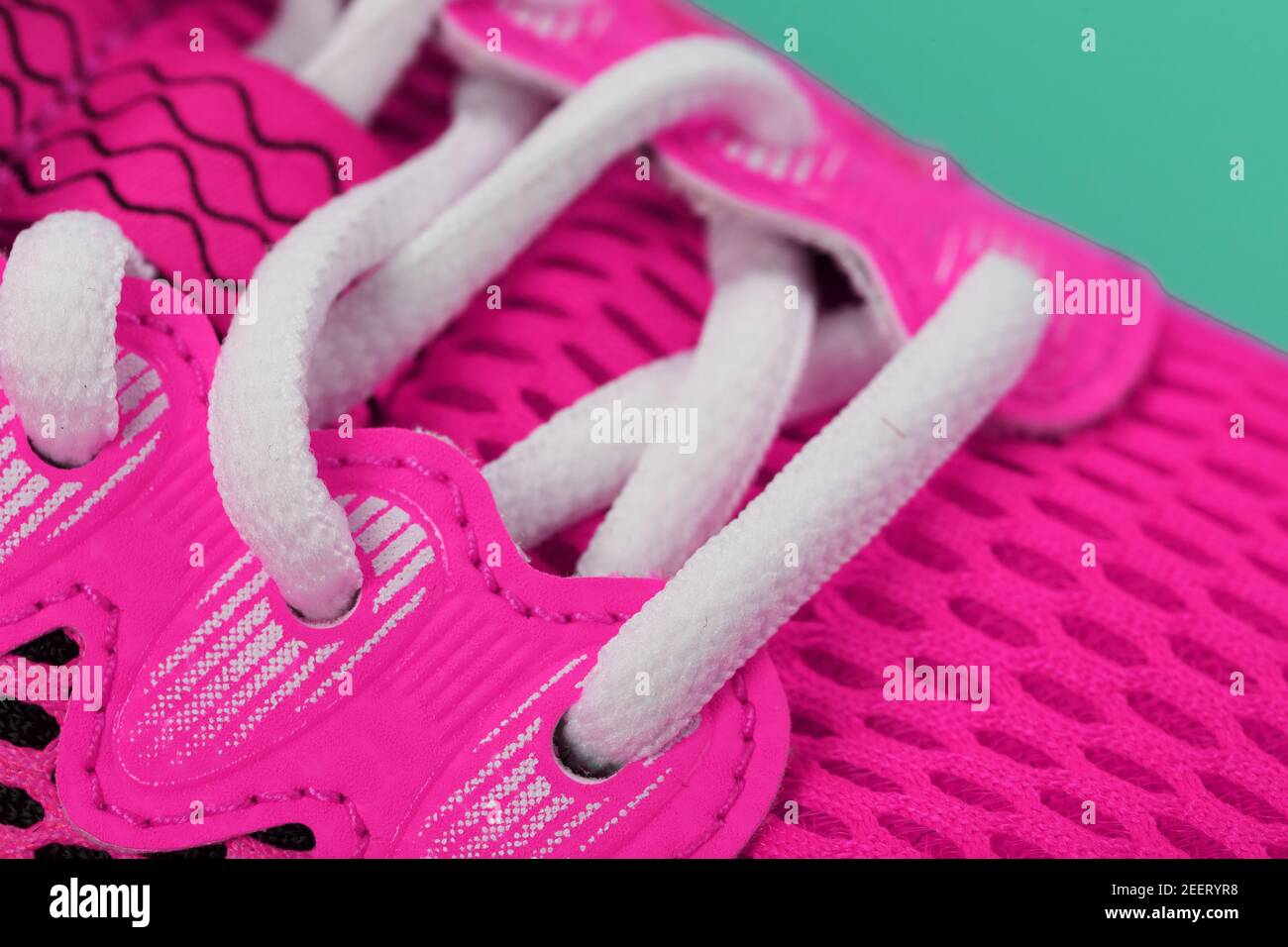 Fragment of a pink sneaker with lacing in full screen close-up. Texture ...