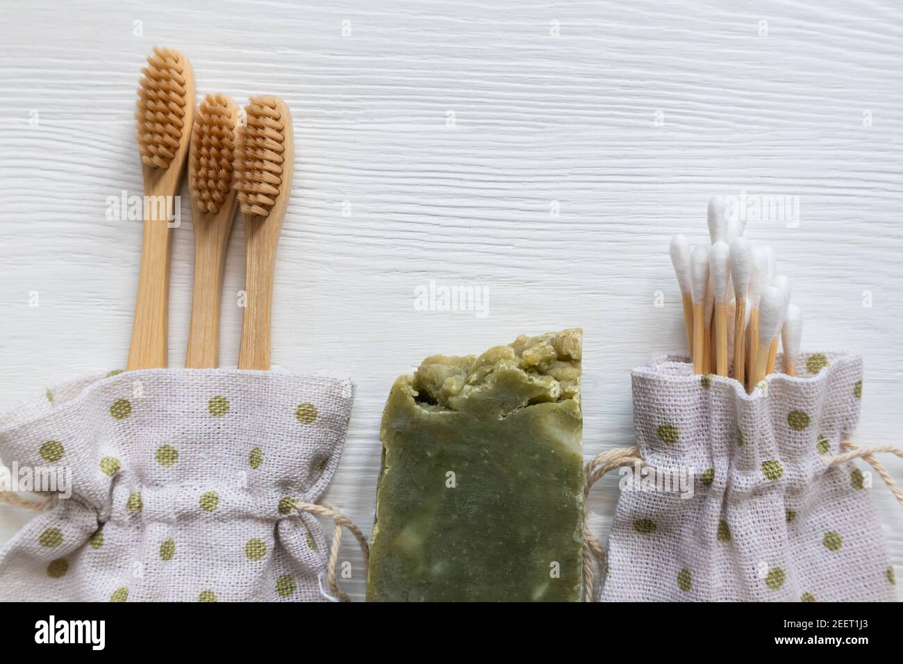 Eco-friendly personal care and home cleaning items on a white ...