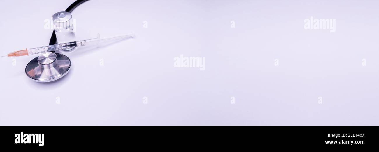 Doctor blue stethoscope for cardiac on white background with syringe ...