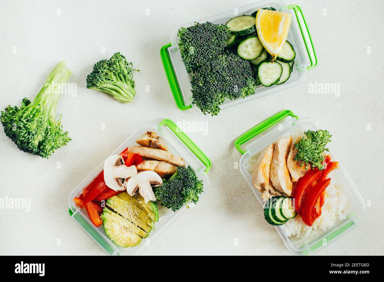 top view of lunch boxes with food on white background Stock Photo - Alamy