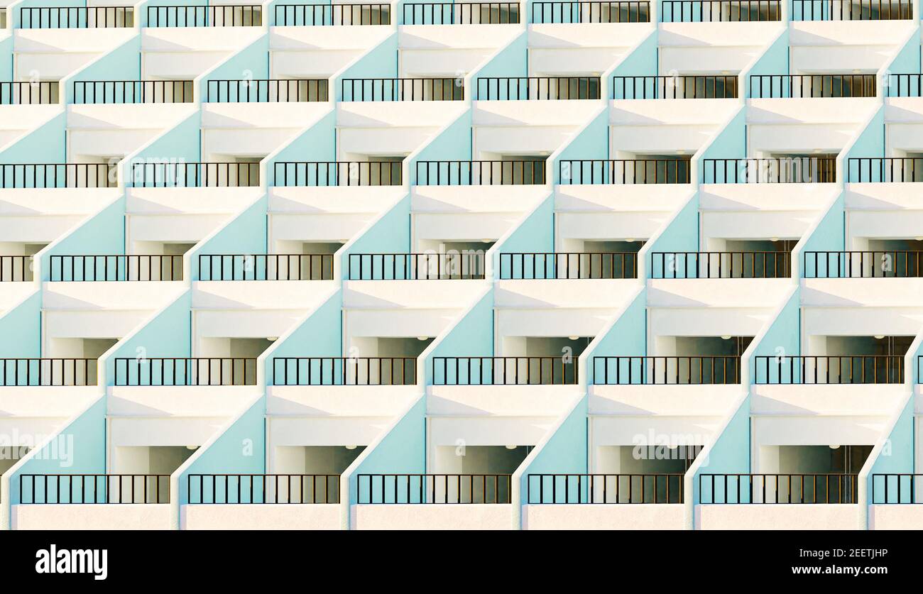 facade of apartments with their terraces illuminated by the sun at ...