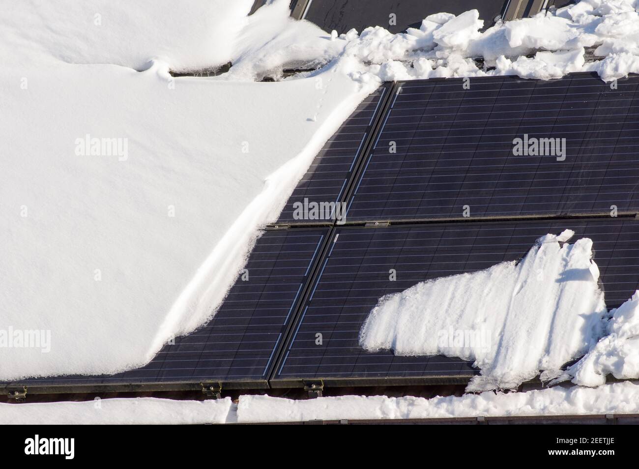 Solar panels for electric power generation covered by snow Stock Photo ...