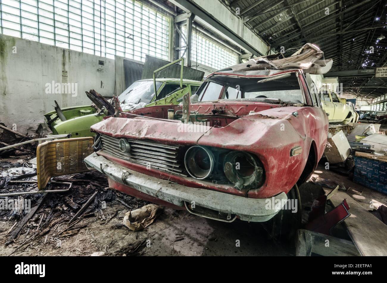 broken red car in an old hall Stock Photo - Alamy