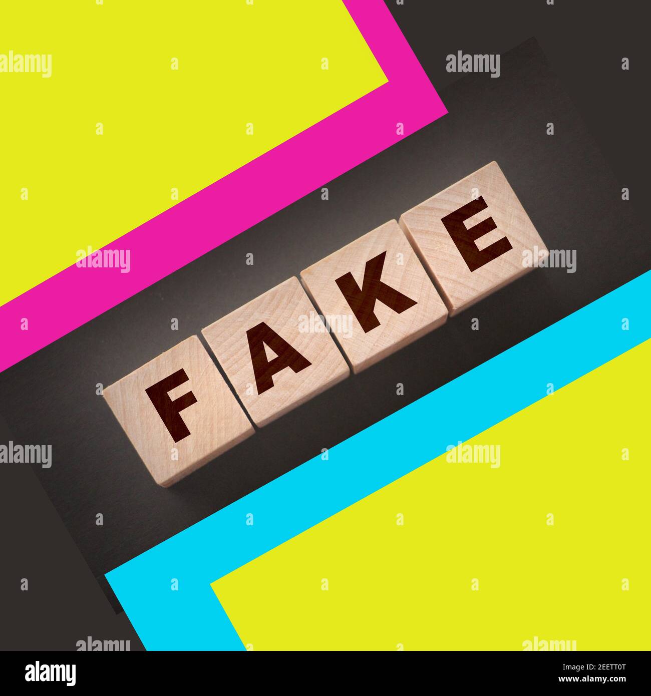 FAKE word written in wooden blocks on black background Stock Photo - Alamy