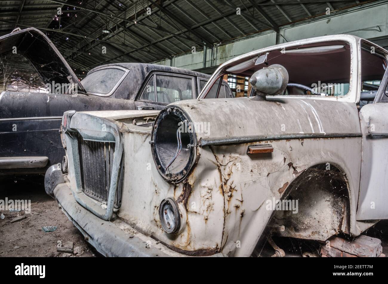 old rusty cars in a workshop Stock Photo - Alamy