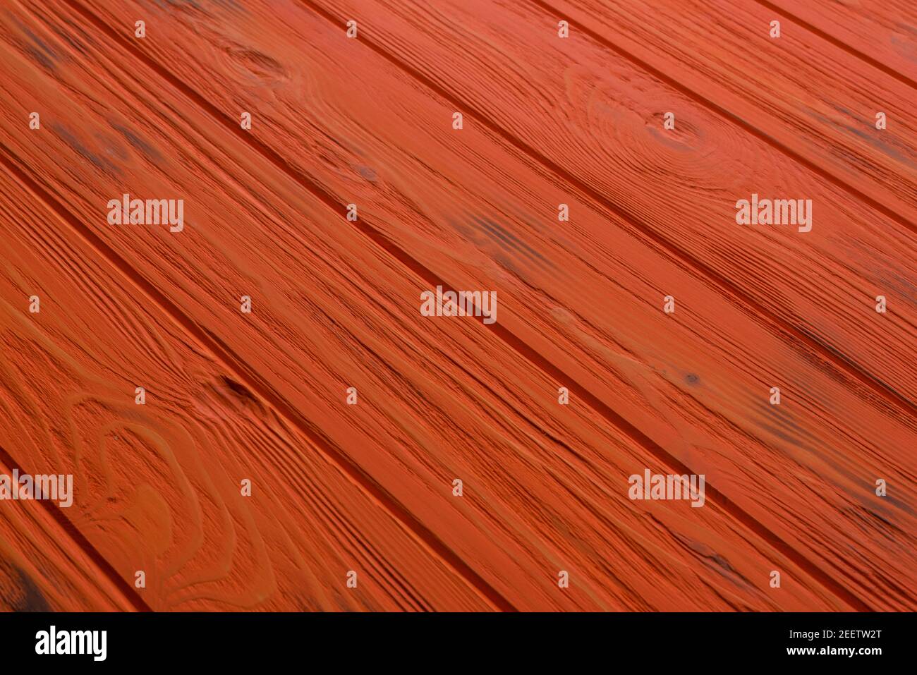 the background of new orange painted wood. Wooden wall floor table ...