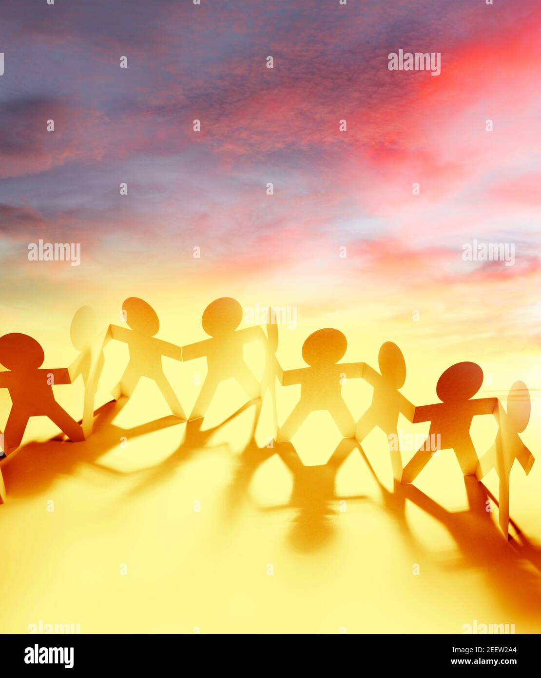 Paper chain team holding hands and sky. Teamwork. Partnership Stock ...