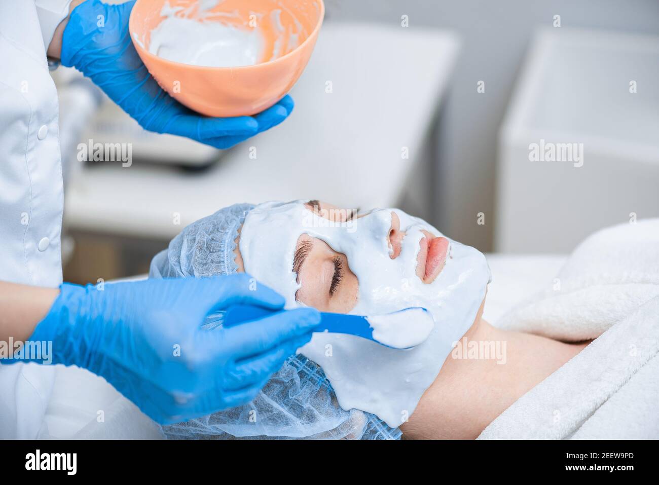 Moisturizing the skin with an alginate mask in modern cosmetology Stock ...