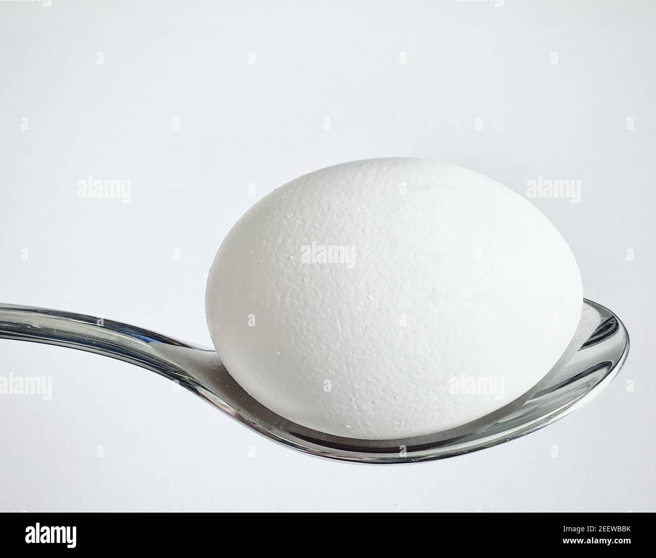 Egg on a spoon Stock Photo - Alamy