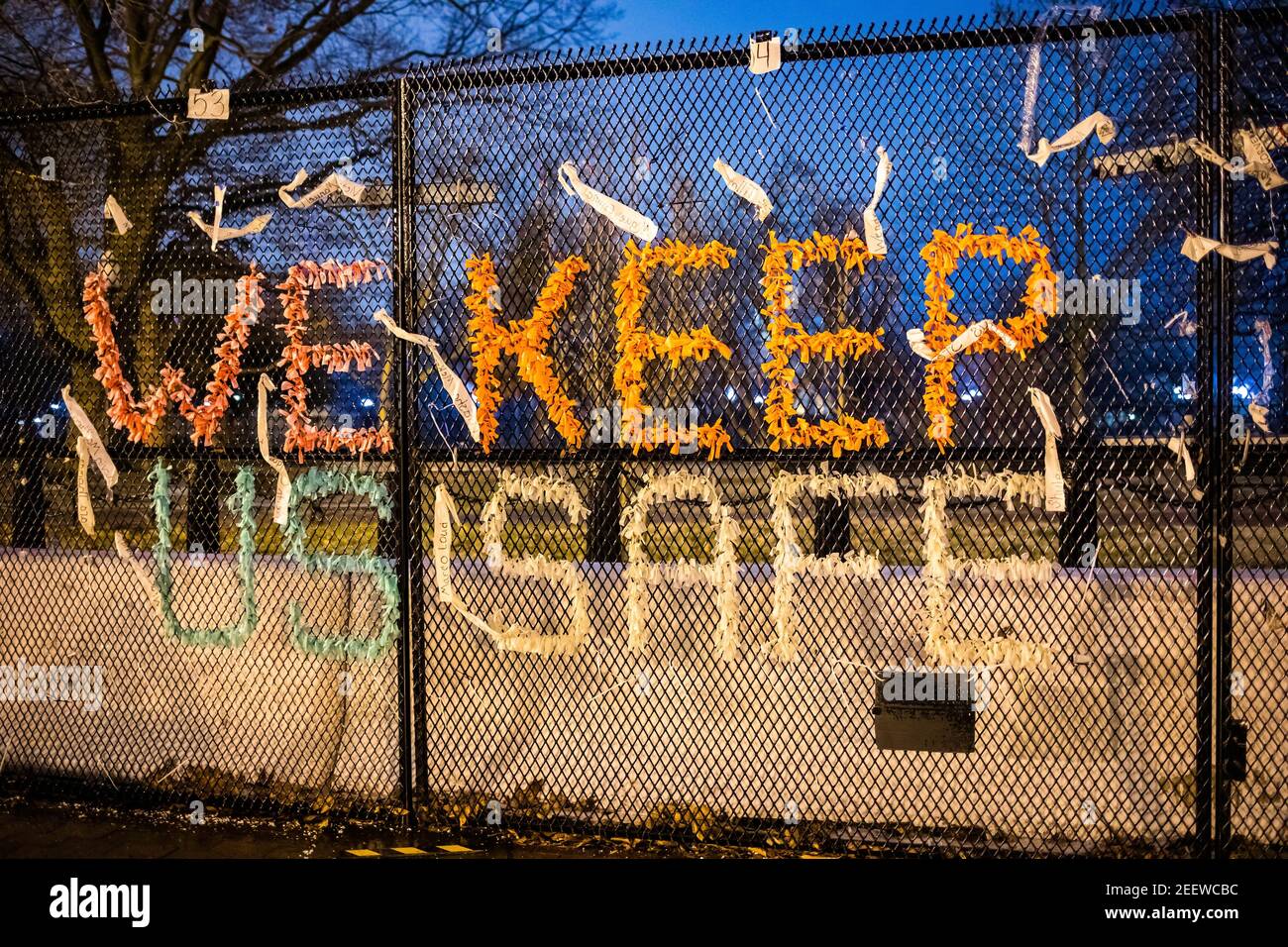 Protests sign we keep us safe on a security fence surrounding White ...
