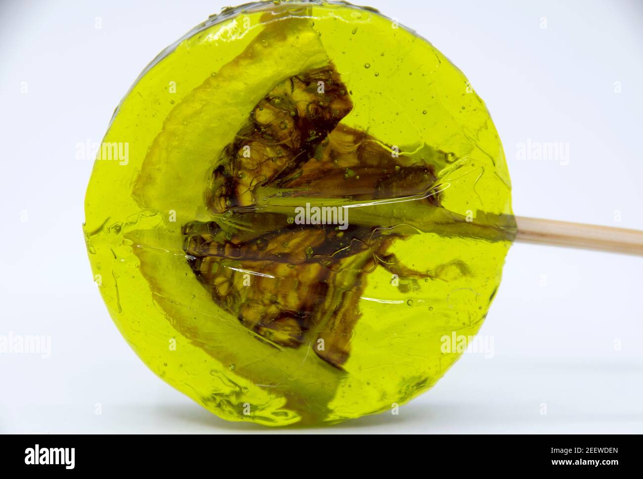 Yellow lollipop with lemon slice inside on white background Stock Photo ...