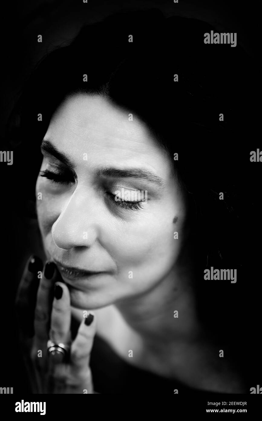 woman with sad and melancholic expression II Stock Photo - Alamy