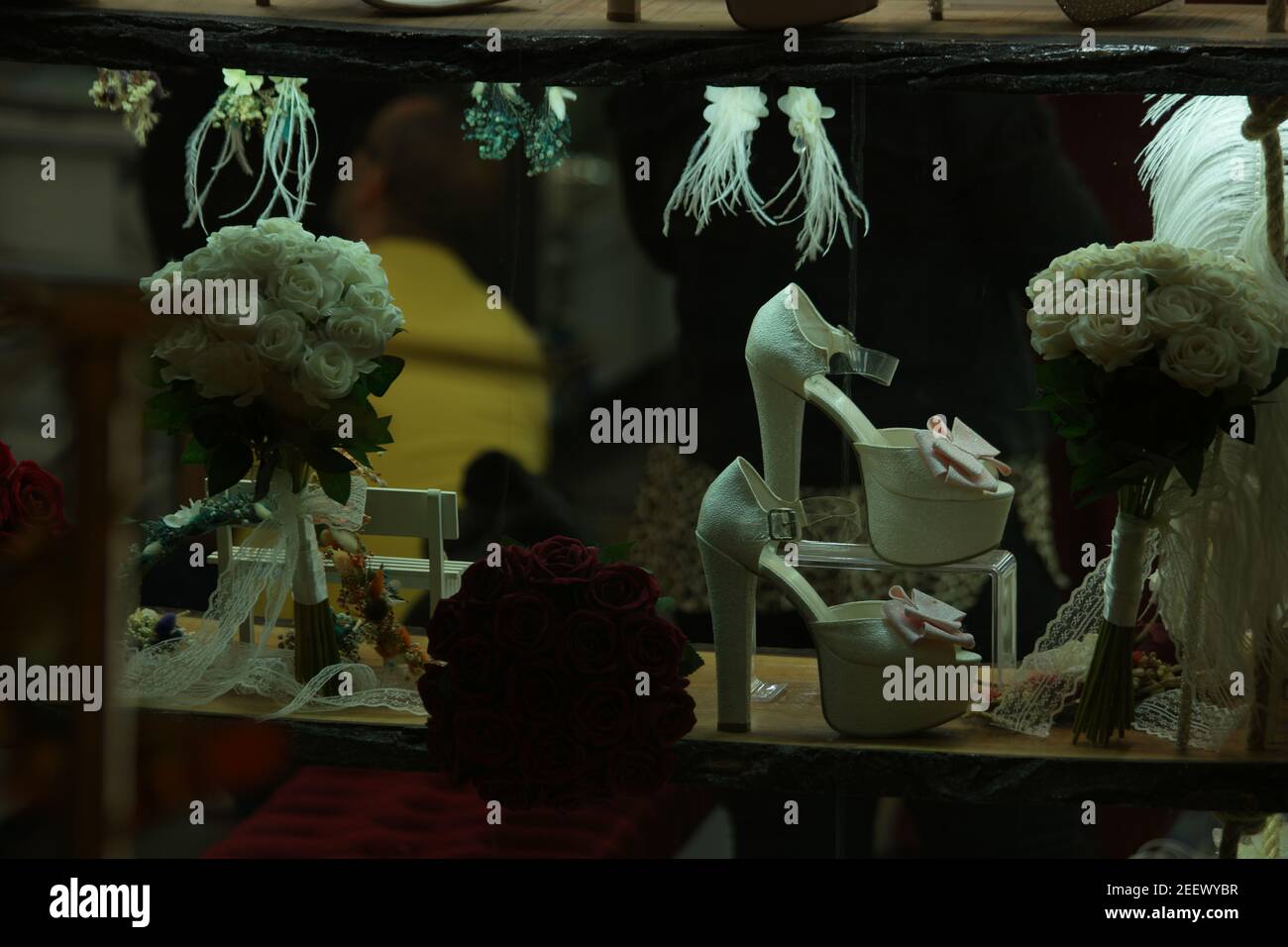 Display with bridal bouquet and shoes in wedding salon Stock Photo - Alamy
