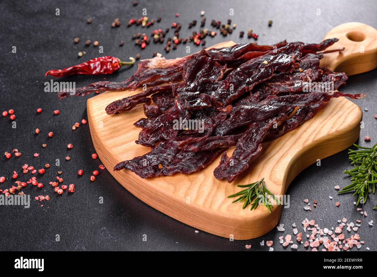 Tasty hearty meat salted and dried with pieces of spices and herbs ...