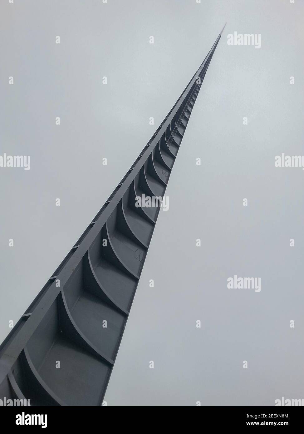 Wroclaw Iglica statue at clean cloudy day Stock Photo - Alamy