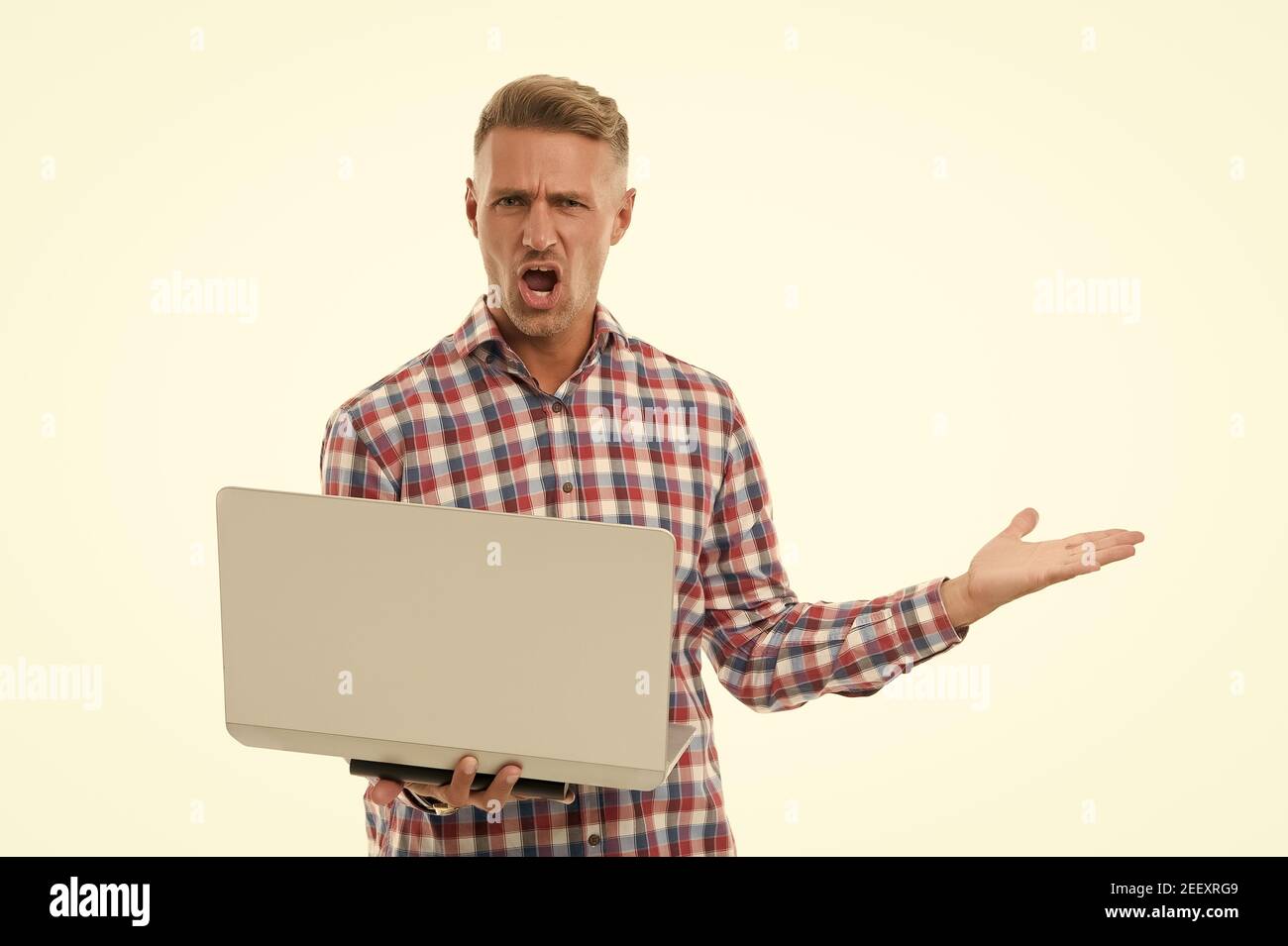 Virus alert. Desperate man hold laptop isolated on white. Computer ...