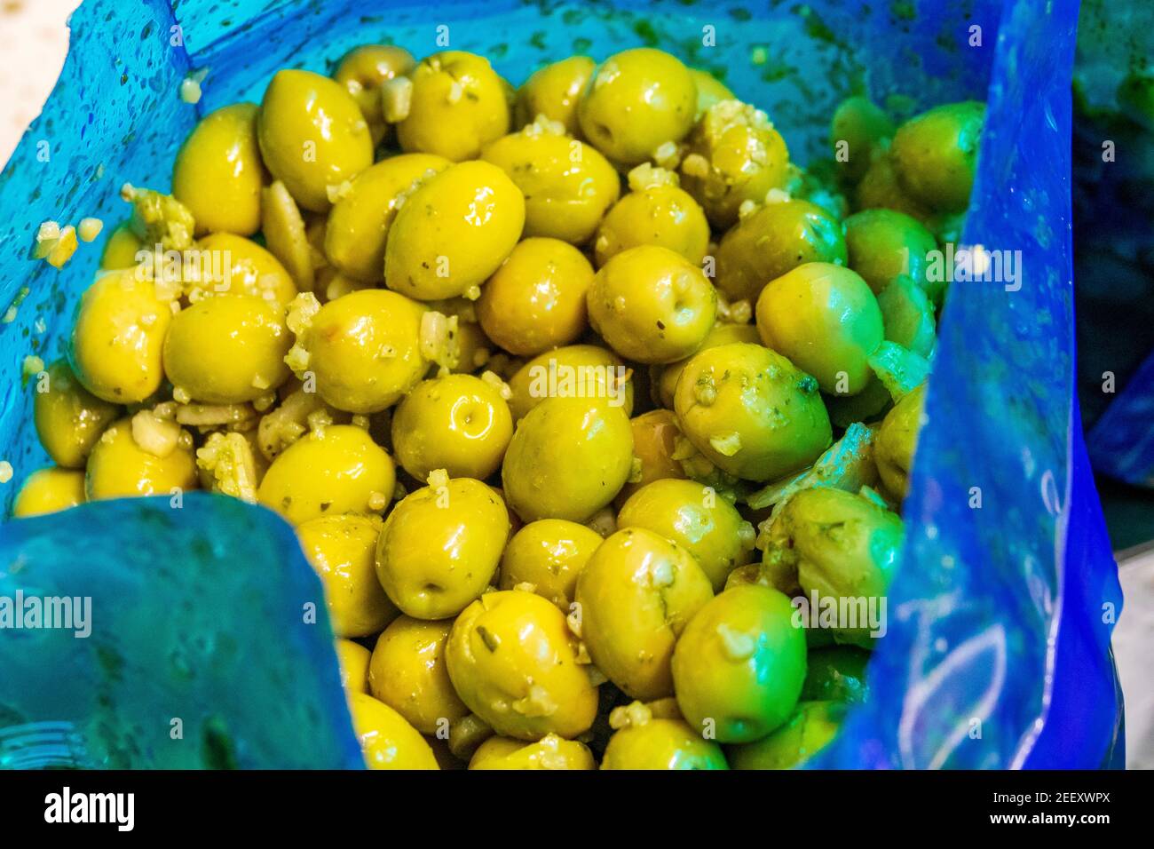 A large bag of green olives ready for bulk purchase at a zero-waste ...