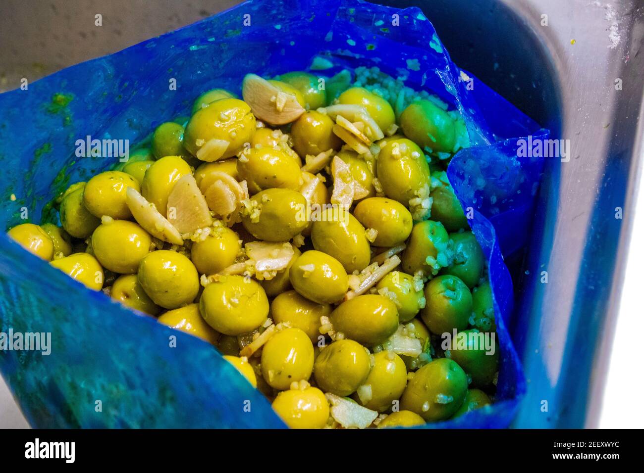 A large bag of green olives ready for bulk purchase at a zero-waste ...