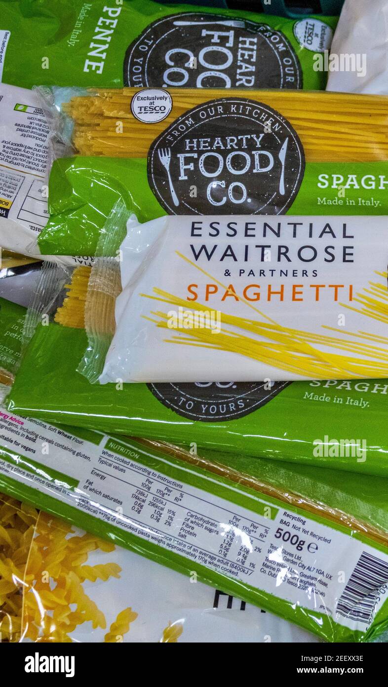 Packets of spaghetti and pasta in a crate of dry packet food donations ...