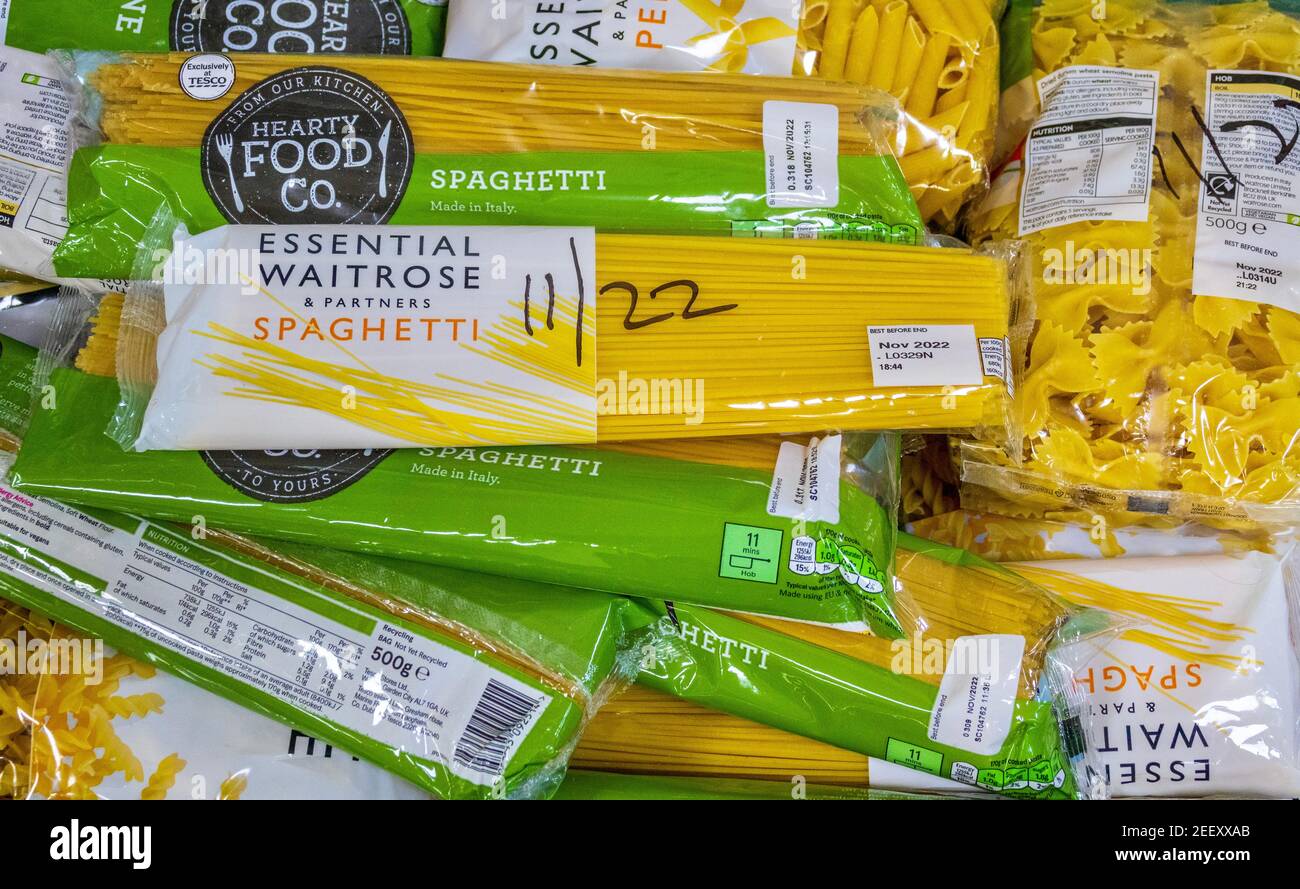 Packets of spaghetti and pasta in a crate of dry packet food donations ...